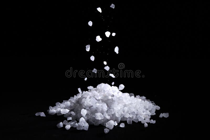 Sea Salt Crystals Fall on a Pile of Salt, Black Background Stock Image ...