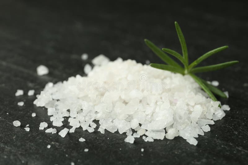 Sea Salt and Rosemary on Dark Gray Textured Table, Closeup Stock Photo ...