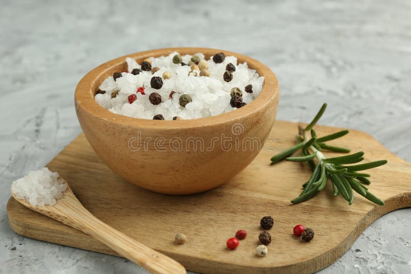 Sea Salt and Spices in Bowl on Gray Textured Table, Closeup Stock Photo ...