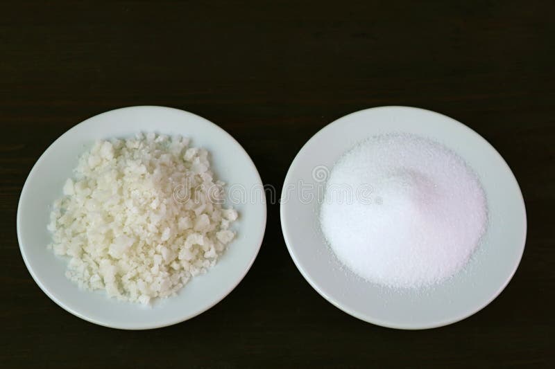 Sea Salt and Table Salt Isolated on Black Background Stock Image ...