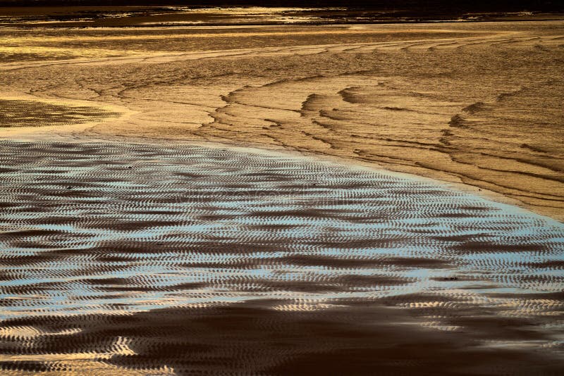 Sea and Sand Trace from the Waves on the Seashore in the Background ...