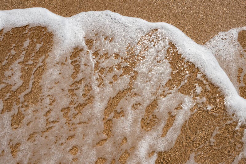 Sea sand with water splash stock photo. Image of scenic - 192409984