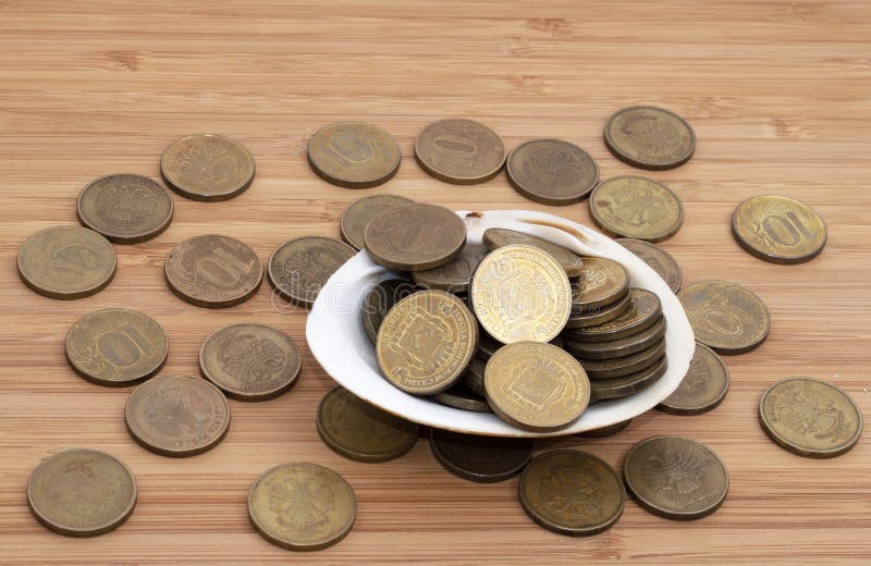 A sea shell with coins stock image. Image of travel - 104768157