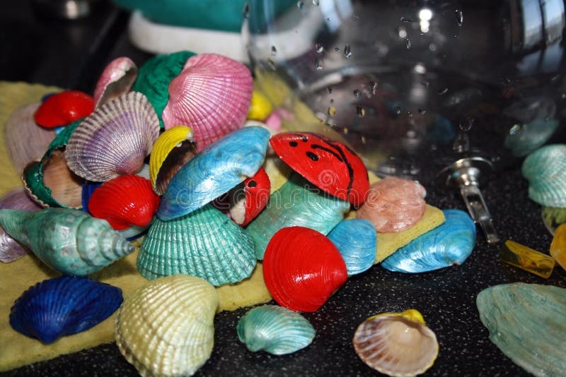 Sea Shells Painted in Different Colors. Needlework with Children Stock ...