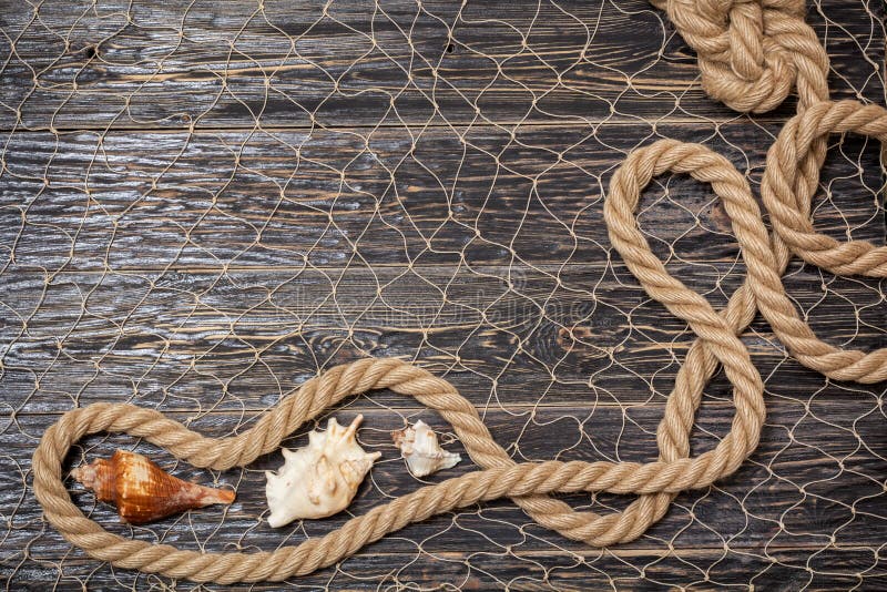 Sea Shells and Rope on Old Dark Boards Stock Photo - Image of string ...