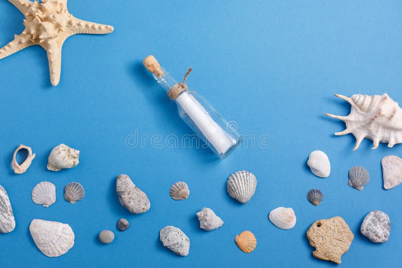 Sea Shells Starfish and a Message in a Bottle on a Turquoise Background ...
