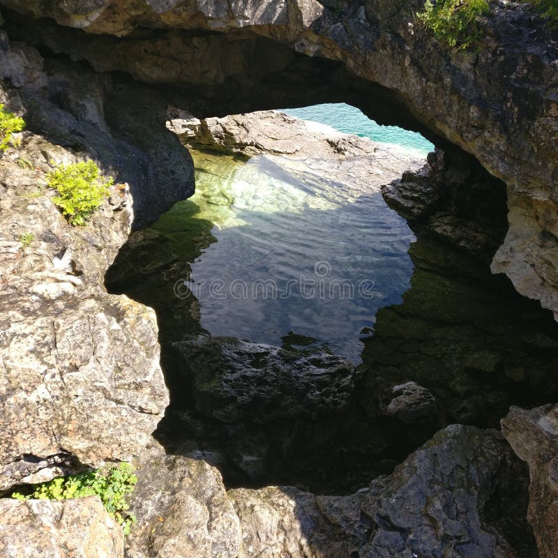 Sea shore cave stock photo. Image of reflection, cave - 96582116
