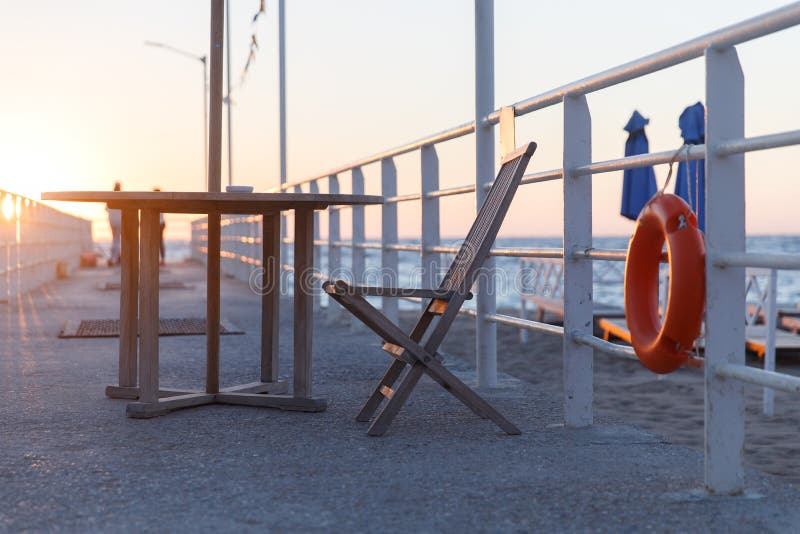 Sea shore with life buoy stock photo. Image of promenade - 85769556