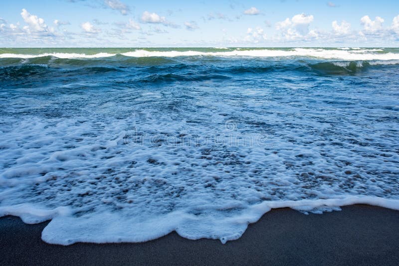 Sea shore scene and waves stock image. Image of foam - 240523403