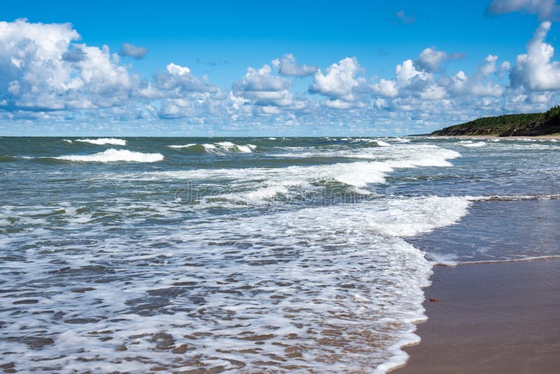 Sea shore scene and waves stock photo. Image of sunlight - 240523406