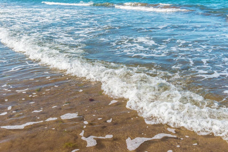 Sea shore with small waves stock image. Image of natural - 157973525