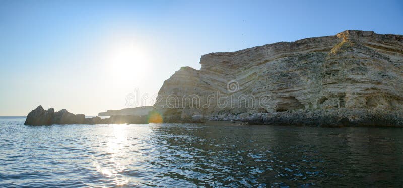 Sea Shore with Steep Cliffs on a Summer Evening Stock Photo - Image of ...