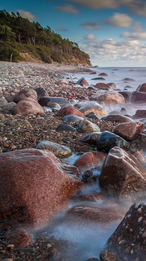 Sea shore with stones stock image. Image of geology - 324013807