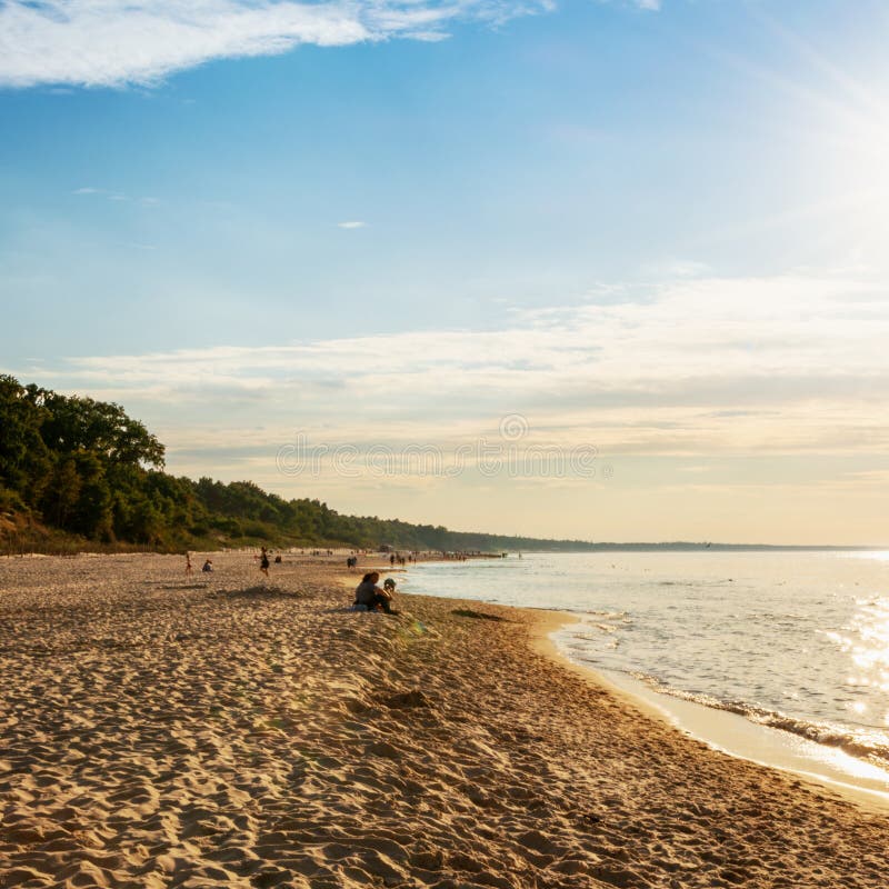 Sea Side Sun Goes Down on Holiday Stock Photo - Image of beach, clouds ...