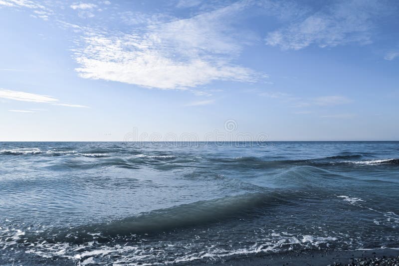 Beautiful Seascape with Waves. Blue Sea, Sky and White Clouds Stock ...