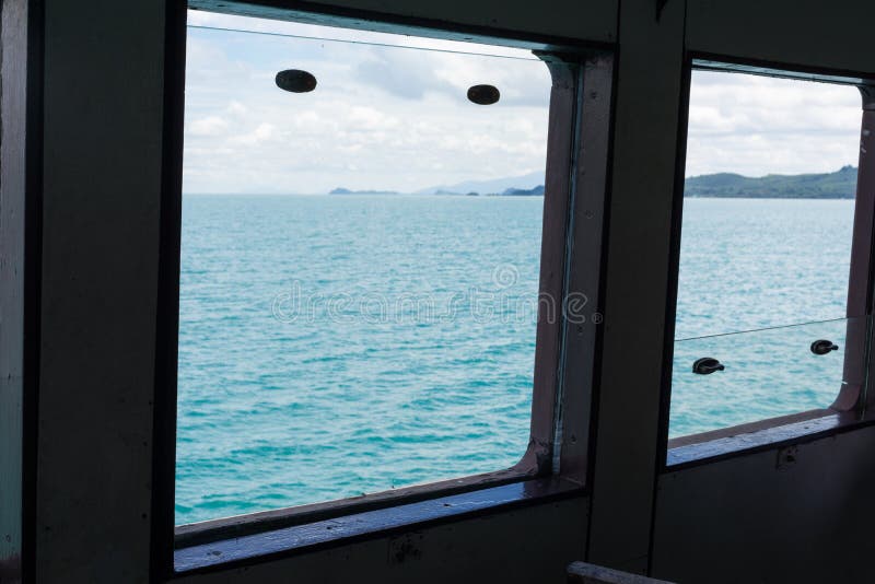Windows of a Ferry Boat Reflecting and Showing the View of the Water ...