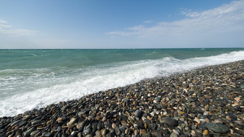 Sea with Small Waves on a Pebble Beach Stock Photo - Image of seashells ...