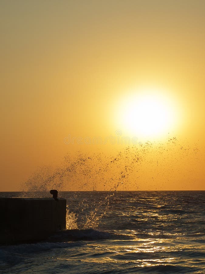 Sea splashes at sunset stock photo. Image of rhodes, splat - 10656524