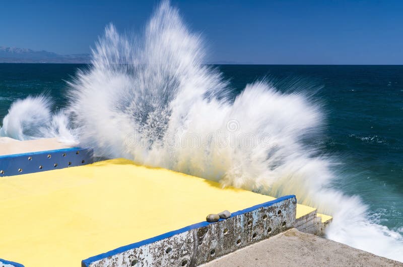Sea Spray Splashes Against the Pier by the Sea Stock Photo - Image of ...