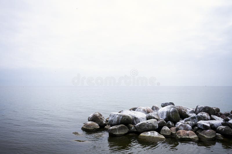 Sea with stones stock photo. Image of horizon, seascape - 173944552