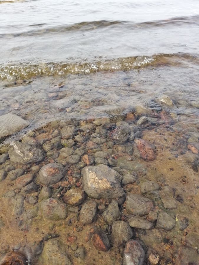 Stones and Waves of the Sea Stock Image - Image of rocks, water: 145601943