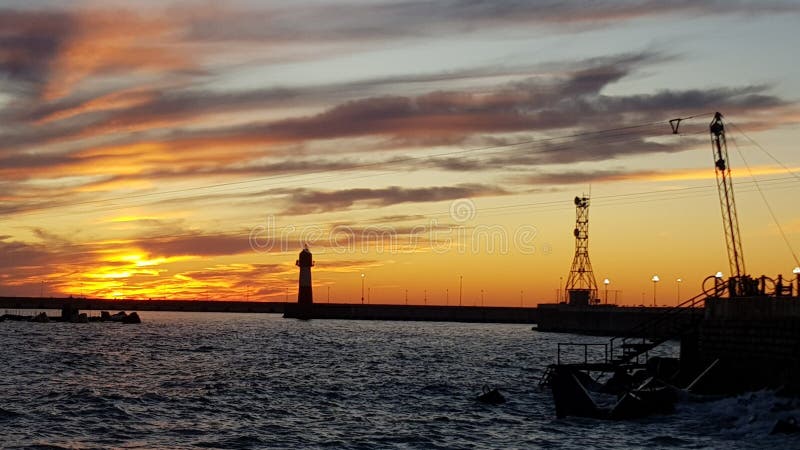 Sunset stock photo. Image of port, nature, cloud, lighthouse - 111183656