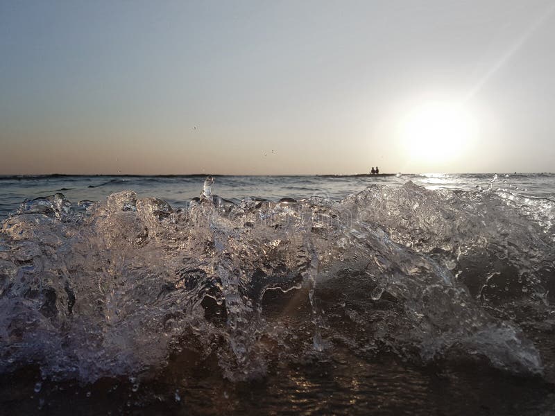 Sea Sunset. Surf Waves in the Light of the Setting Sun Stock Photo ...