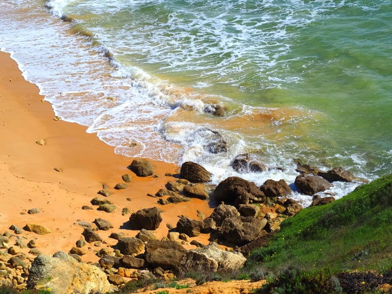 Sea Surf at a Typical Algarve Beach with Cliffs Rocks and Red Sand ...