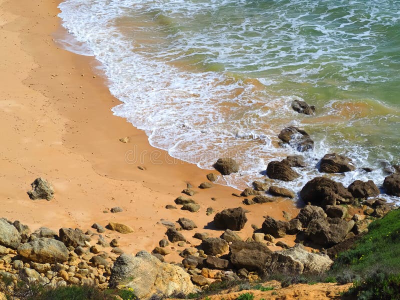 Sea Surf at a Typical Algarve Beach with Cliffs Rocks and Red Sand ...