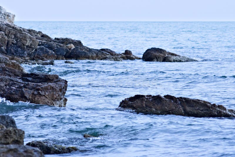 Sea Surface and Rock Cliffs Emerging from the Water. Stock Photo ...