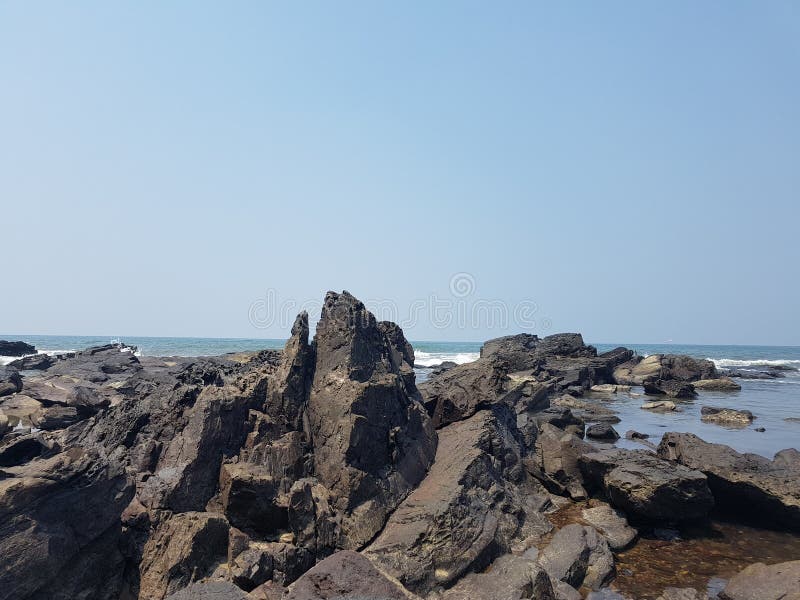 Rocky beach shore stock image. Image of waves, beach - 113867793