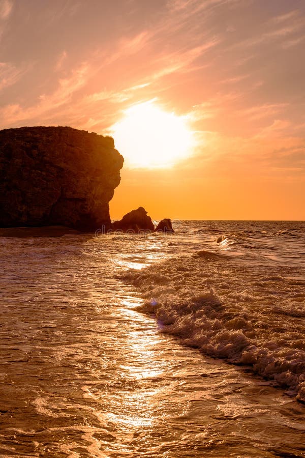 Sea Vertical Landscape. Sunset Over the Sea and Rocks Stock Image ...