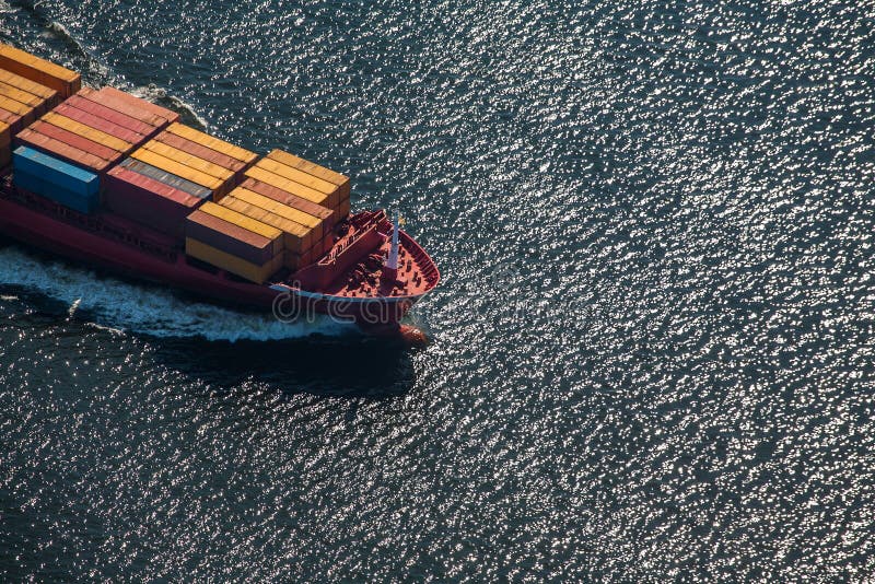 A Sea Vessel is a Container Ship at Full Speed in the Open Sea. View ...