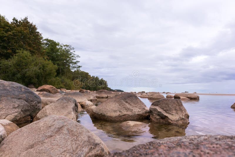 Sea View with Cloudy Blue Sky, Green Forest and Different Rocks Stock ...
