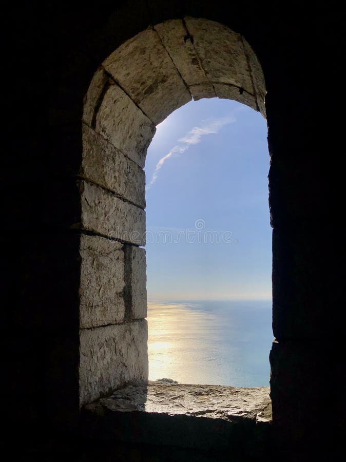 Sea View through the Oval Window of the Stone Tower. Stock Photo ...