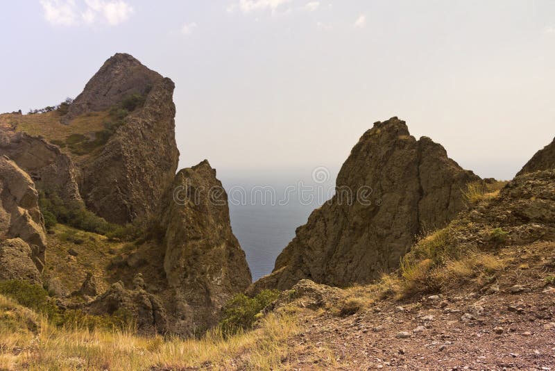 Sea View in between Two Cliffs of the Mountain Massif Kara-dag. Stock ...