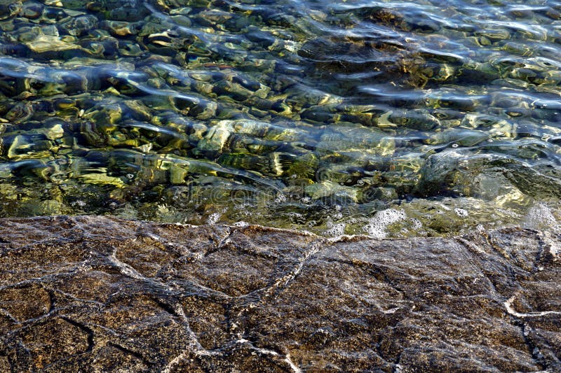 Shore of the Sea Covered in Rocks and Snow on a Gloomy Day in Winter in ...
