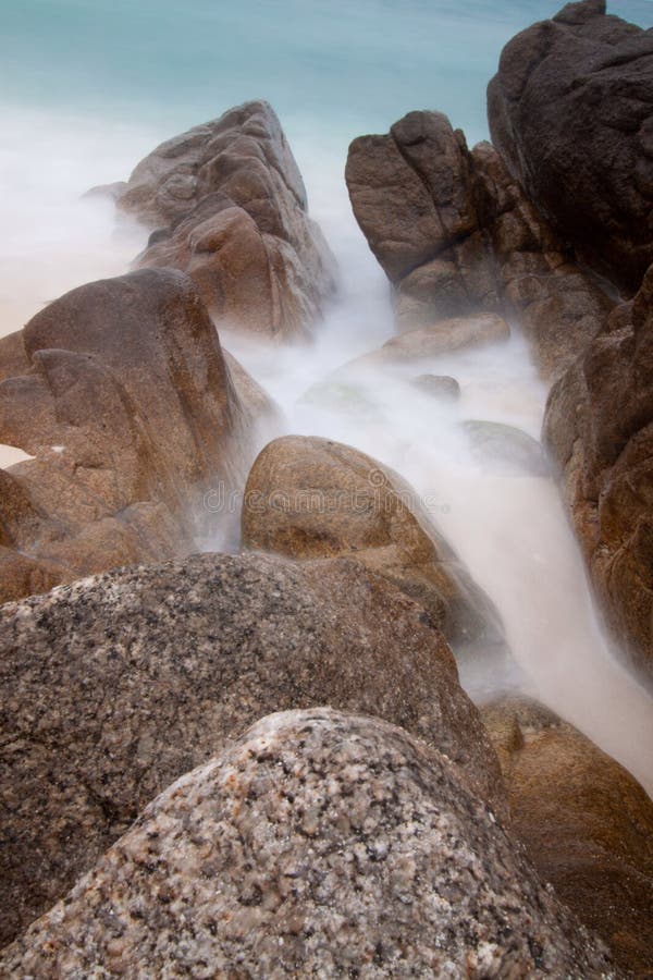 Sea water flow over stone stock photo. Image of flow - 48548100