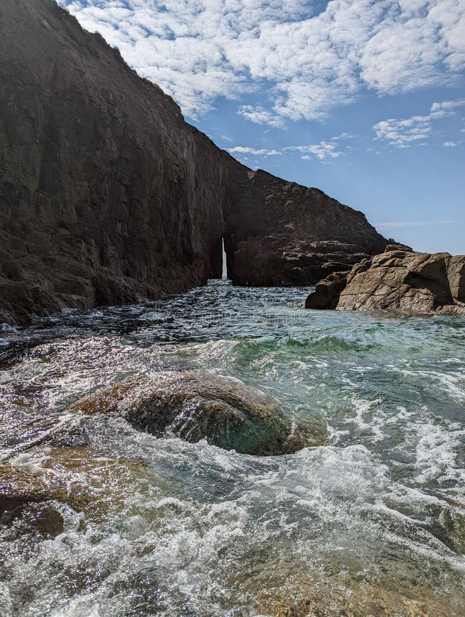 Sea water over rocks stock photo. Image of tourism, beautiful - 265713640