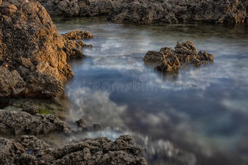 Sea Water Textures and Rocks at Sunrise Stock Image - Image of ...