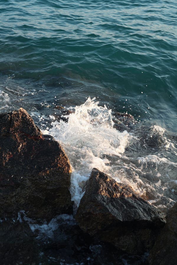 Sea wave break on stone stock photo. Image of extreme - 34108036