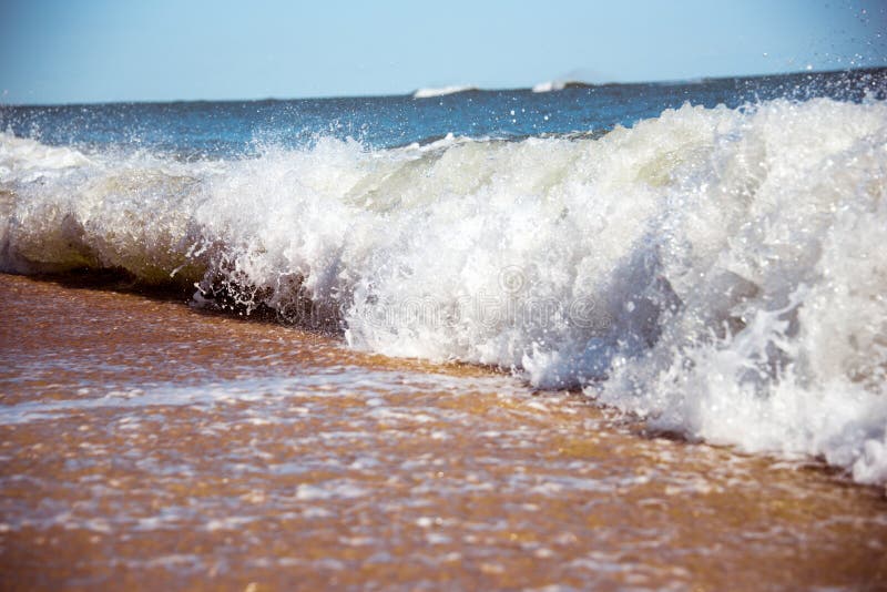 Sea Wave Breaking on the Beach in a Sunny Day Stock Photo - Image of ...