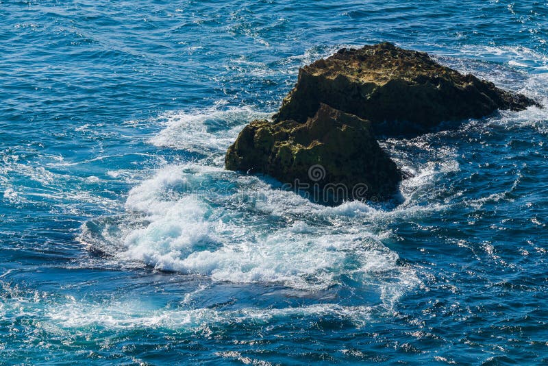 Rock and breaking waves stock image. Image of stone, avacha - 64949823