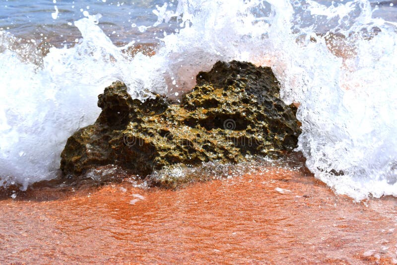 The sea wave hits the rock stock photo. Image of rock - 322525186
