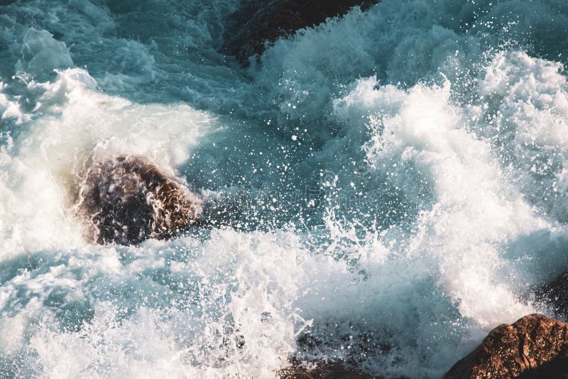 A Sea Wave Hitting Stones Makes an Explosion of Spray. Sea Element ...