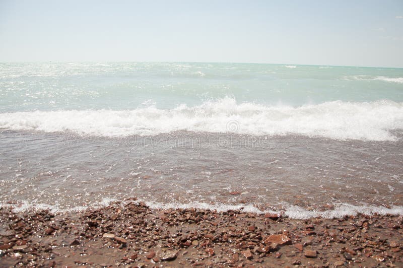 Sea wave and pebble beach stock photo. Image of landscape - 98831190