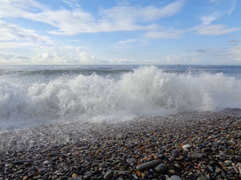 Sea wave on pebble beach stock photo. Image of relax - 65631826