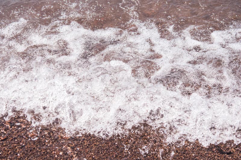 Sea wave and pebble beach stock photo. Image of landscape - 98831130
