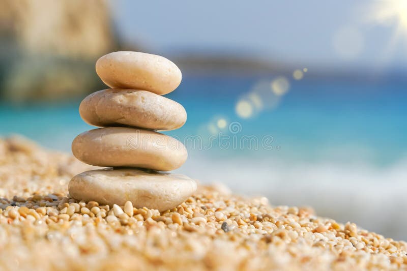 Sea Wave and Pyramid Stones Balance at Sea Background with Sunlight ...