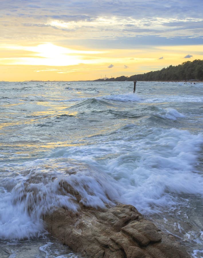 Sea wave and rock sunset stock image. Image of vacations - 32086729